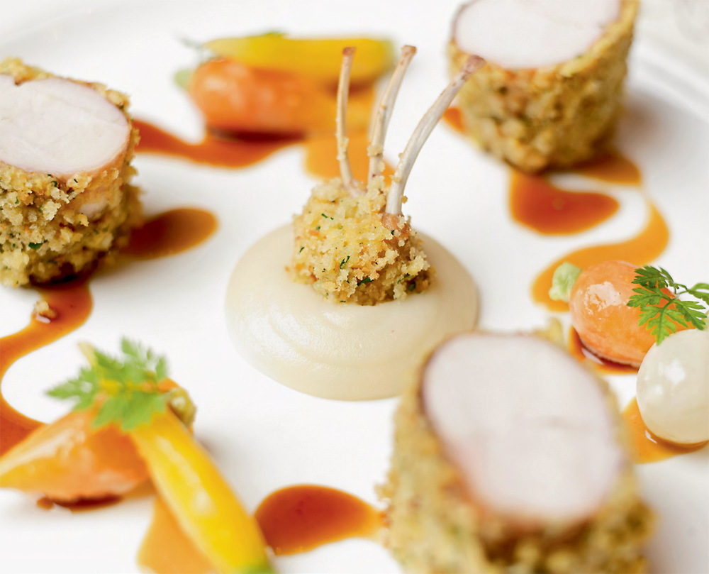 Medallions of rabbit loin wrapped in pancetta surrounding a Lilliputian ...